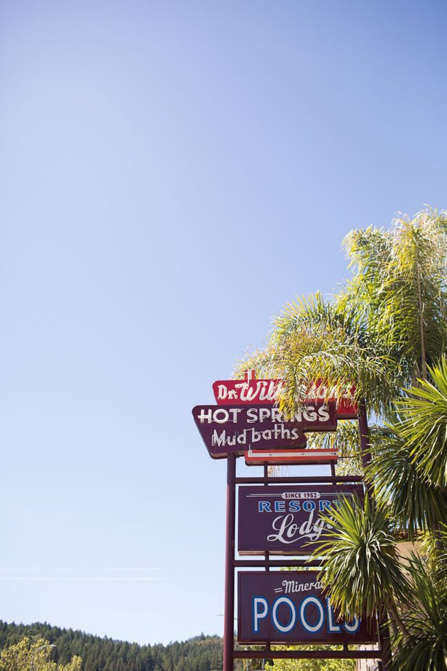 Hot Springs signage a vineyard view | GFF Magazine